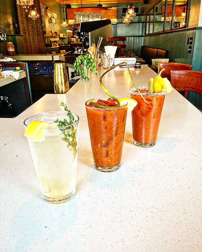 The holy trinity of brunch: a classic cocktail, two spicy Bloody Marys, and enough garnishes to count as a salad course.