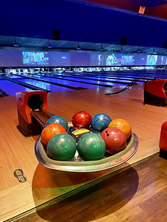 Pristine lanes stretch into infinity, while white deer silhouettes add a whimsical touch to the modern bowling experience.
