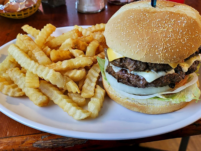 A classic American burger that doesn't need fancy toppings to tell its delicious story, accompanied by crispy crinkle-cut fries.