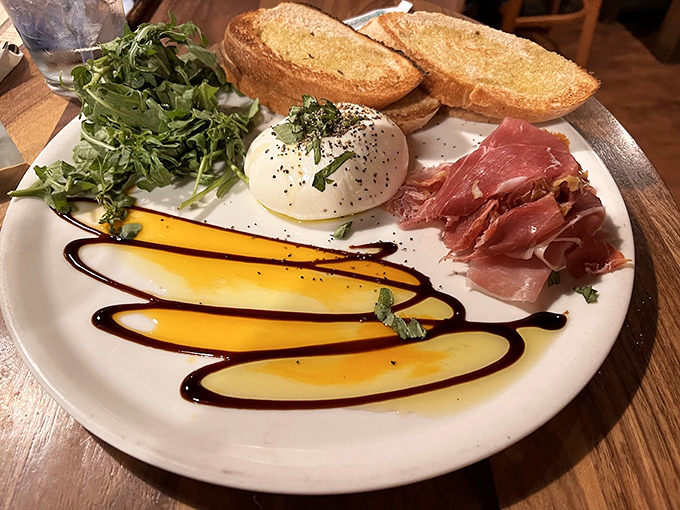 A plate that screams "That's amore!" Burrata, prosciutto, and greens - it's like a first date that's guaranteed to go well.