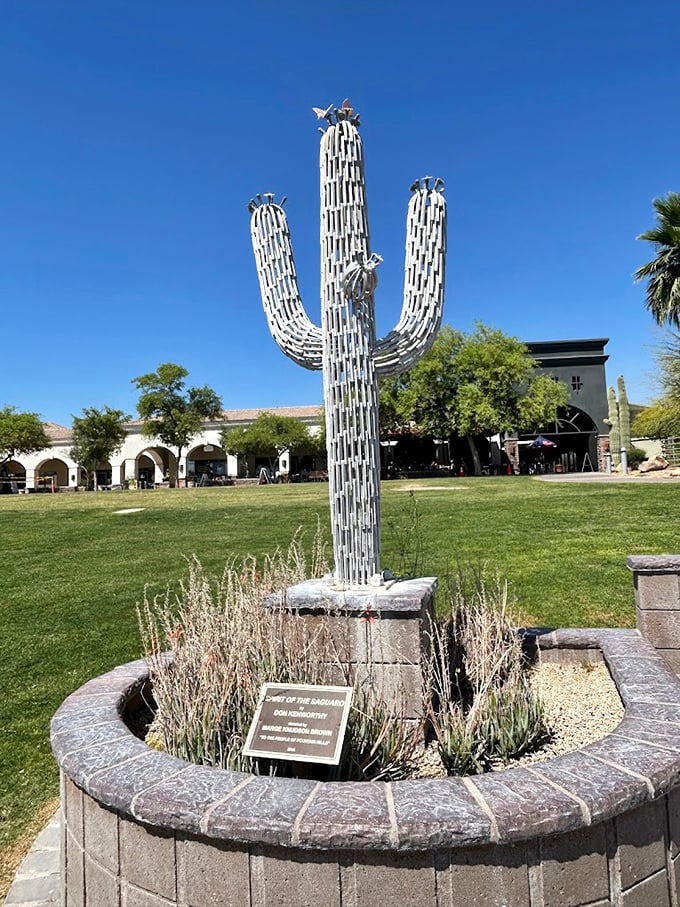 This gleaming metallic saguaro captures the spirit of Arizona, standing tall like a desert sentinel beside the fountain.