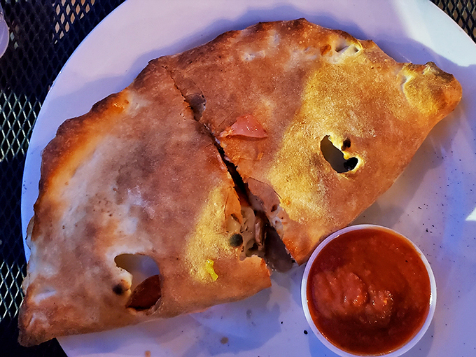 Warning: This calzone may cause spontaneous happiness. Mimmo's stuffs more flavor into one bite than most restaurants manage in an entire meal.