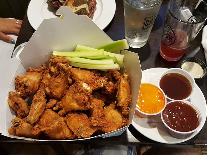 A wing lover's dream come true: crispy wings served with a rainbow of sauces that'll make your taste buds dance.