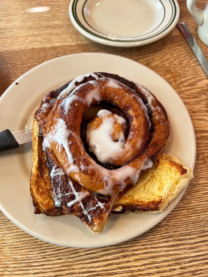 If this cinnamon roll were a person, it'd be the love child of a warm hug and a sugar rush. One bite, and you'll swear you've found the meaning of life.