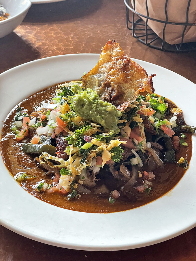 Duck carnitas that quack with flavor! Topped with a garden of goodies, it's like a fiesta in a bowl. Ole!