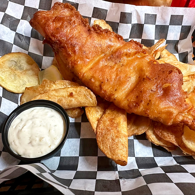 Golden-battered haddock that's crispy enough to make angels sing, served with house-made chips and tangy tartar sauce.
