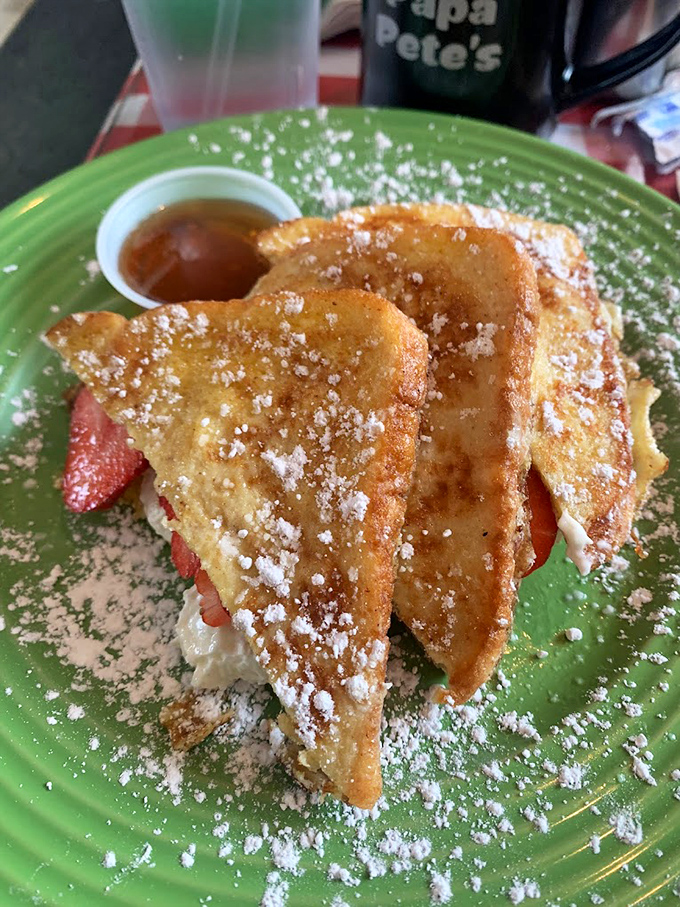 Stuffed French toast that looks like it graduated from culinary school with honors, crowned with fresh berries and powdered sugar.