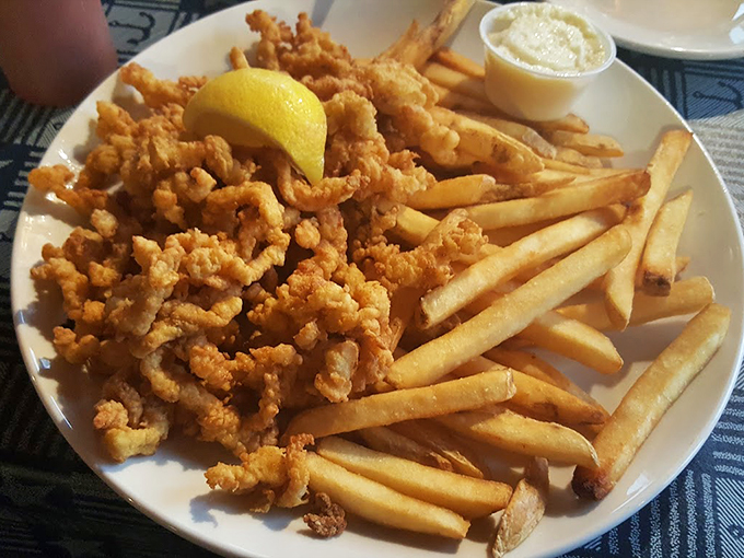 Golden-fried whole belly clams and crispy fries - the kind of plate that makes you forget counting calories exists. Photo credit: Lola Consuela