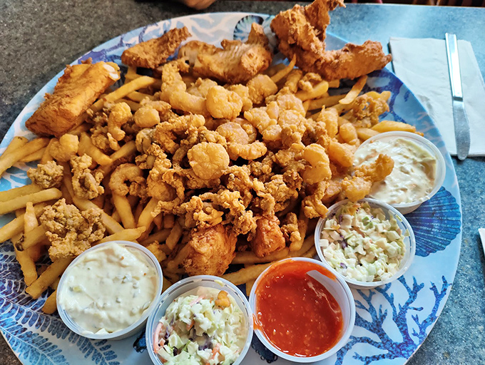 The seafood platter that makes decisions easy - just get everything! Golden-fried perfection with all the fixings.