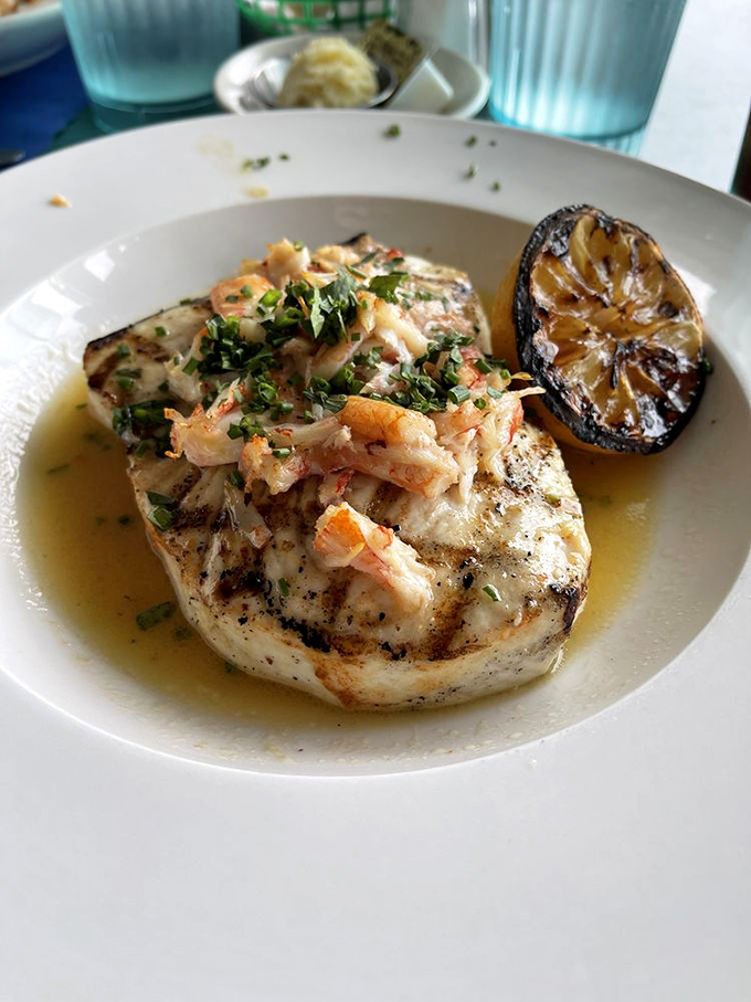 Swordfish that could make Poseidon jealous! Grilled to perfection and topped with a seafood medley. It's like an underwater luau on your plate.