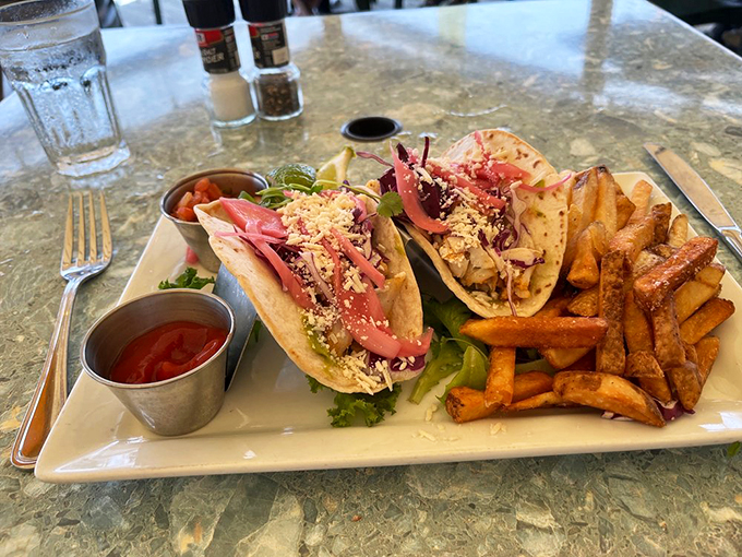 These tacos prove fish can dress up fancy, with fresh slaw and zesty sauce making every bite a little celebration. Photo credit: Kathryn S.