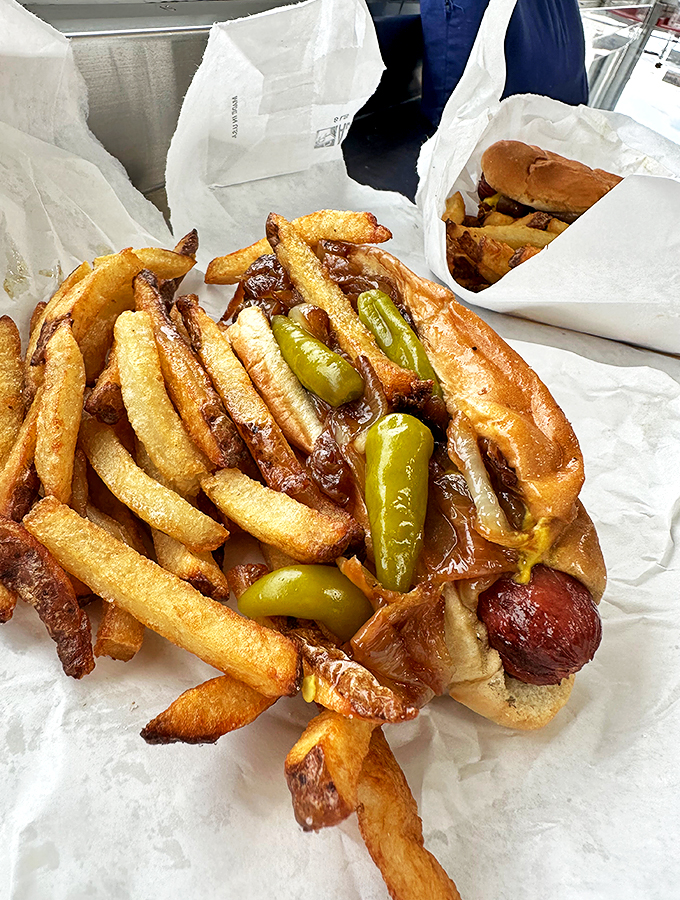 Golden fries crisp enough to make a potato proud, alongside a hot dog dressed to Chicago perfection.
