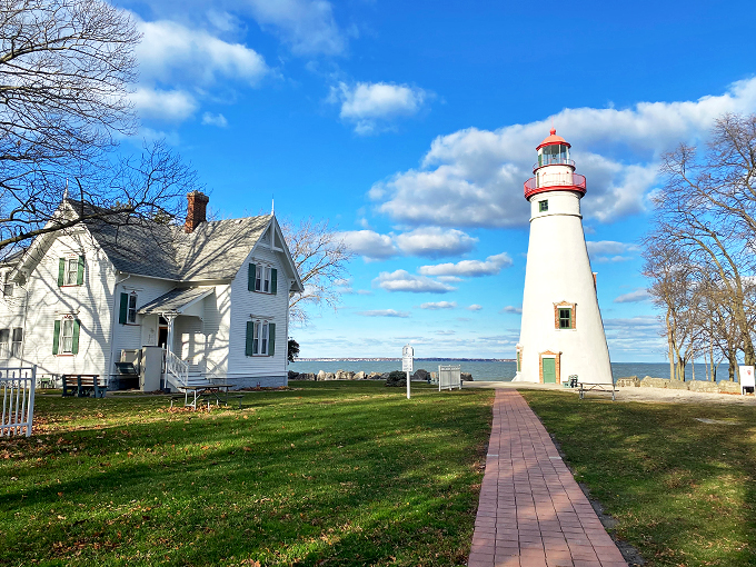 Home sweet lighthouse! This charming keeper's house looks like it's straight out of a Norman Rockwell painting.