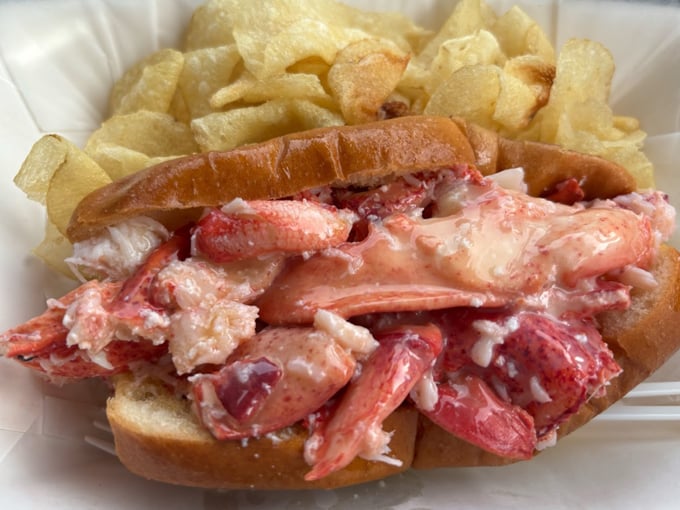 This isn't just lunch&mdash;it's edible sunshine: A perfectly toasted roll cradles fresh lobster meat like it was made for this moment. Photo credit: Jackie C