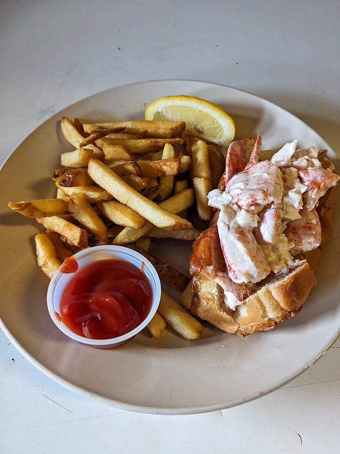 Maine's classic sandwich gets the royal treatment - chunky lobster meat nestled in a toasted roll, with hand-cut fries standing guard.
