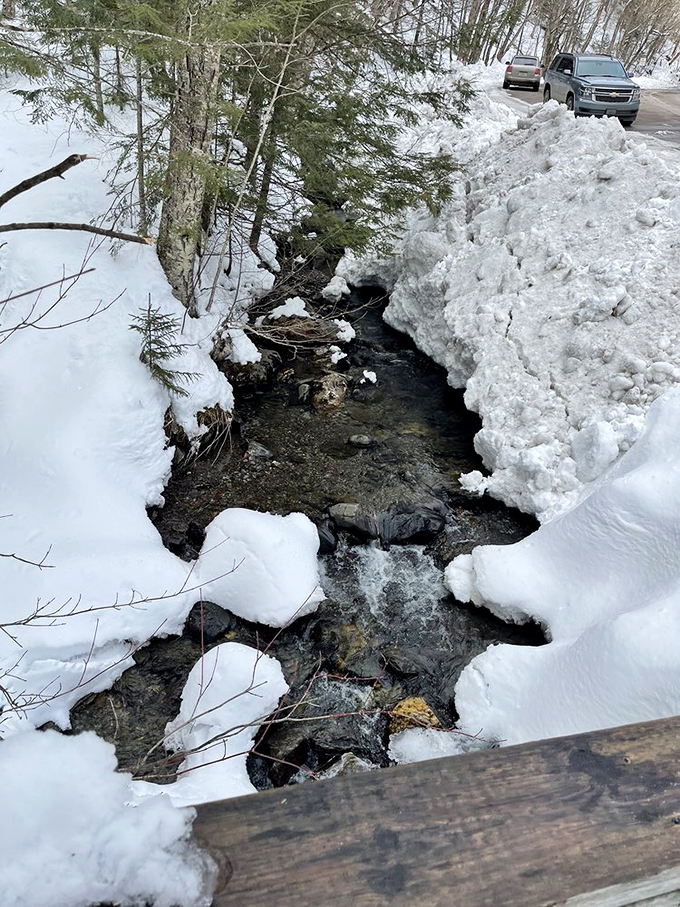 The Mad River in winter: Where rushing water meets its match in Jack Frost's icy embrace.