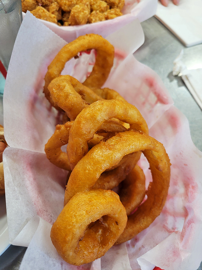 Holy moly, onion rollercoasters! These golden rings are like edible jewelry&mdash;accessorize your meal with a side of crispy, savory perfection.