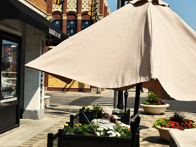 White umbrellas and flower boxes transform this corner of Des Plaines into a charming European-style caf&eacute; experience.