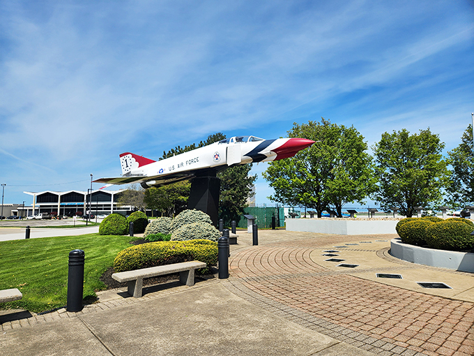 Red, white, and 'whoa'! This sleek Air Force jet stands guard, ready to inspire the next generation of high-flyers.