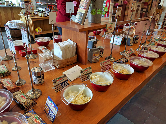 The sampling station: where cheese dreams come true and toothpicks become golden tickets to flavor paradise.