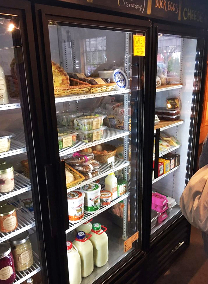 Farm-fresh treasures line these cooler shelves like a carefully curated gallery of Vermont's finest flavors.