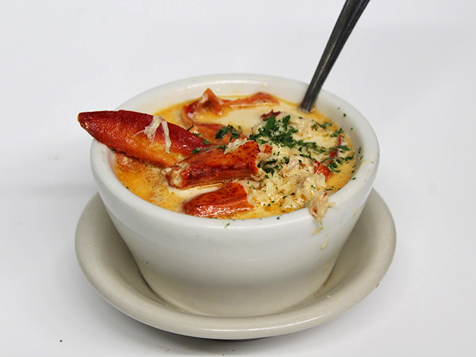 This isn't just chowder, it's a warm hug in a bowl, complete with tender lobster pieces peeking through creamy waves.