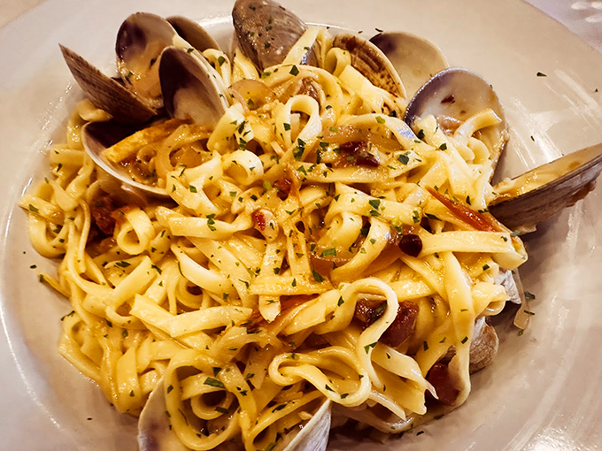 Fresh clams nestle among perfectly cooked pasta strands, like precious pearls in a sea of deliciousness. Photo credit: Jon DiPietro