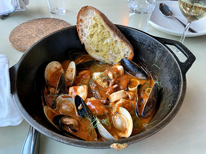 Mussels, fish, and shellfish swim in a rich tomato broth that would make Neptune himself ask for seconds. Photo credit: Eric L.