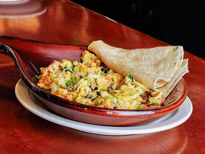 This vibrant scramble, paired with a fresh tortilla, proves that breakfast can be both beautiful and satisfying. Photo credit: 5th Avenue Cafe