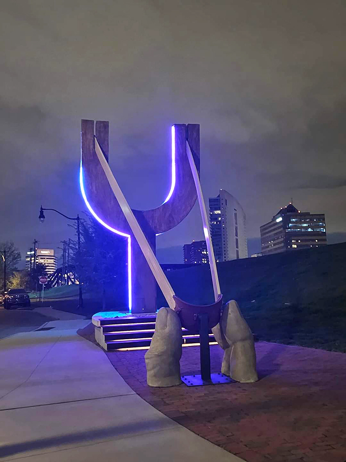 By night, it transforms into a neon dream. Who needs Times Square when you've got this glowing giant in your backyard?