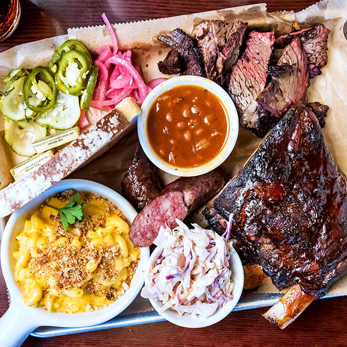 A BBQ platter that would make a Texan tip their hat - smoky meats, creamy mac and cheese, and all the fixings.