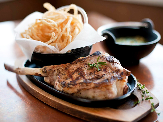 A perfectly grilled steak with fresh herbs tells you everything you need to know about why this place draws crowds. Photo credit: M.C. Perkins Cove