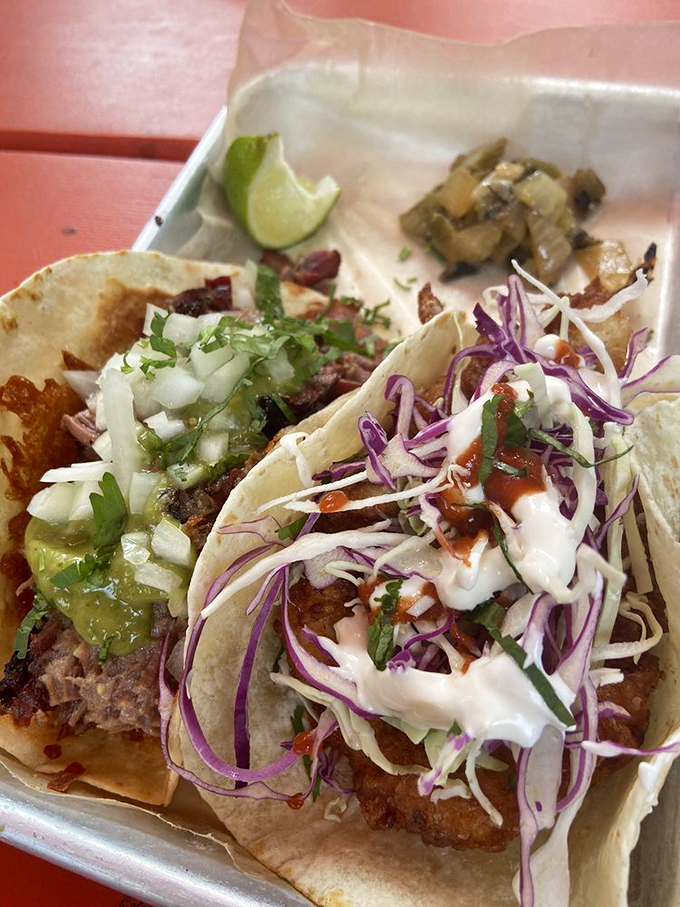Like a well-orchestrated symphony, these tacos balance crispy cabbage, tender meat, and creamy sauce in perfect harmony. Photo credit: Sheryl C.