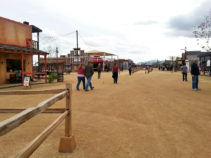 Welcome to the Wild West! The entrance to Rawhide Western Town stands tall under a dramatic Arizona sky, inviting visitors to step back in time and experience the frontier spirit.