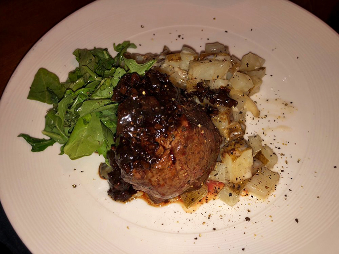 Beef tenderloin that's more tender than a love letter. Paired with greens and potatoes, it's a plate of pure, meaty poetry.
