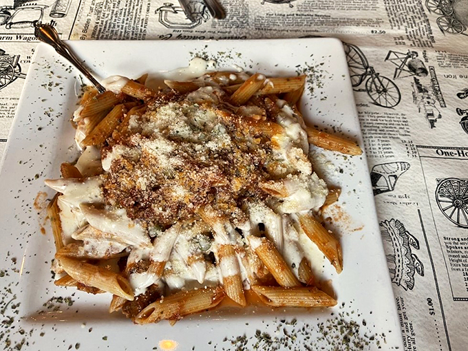 This isn't just pasta; it's a hug for your taste buds. Rich, meaty Bolognese sauce clings to every strand, like it's afraid you might not finish the plate. (You will.)