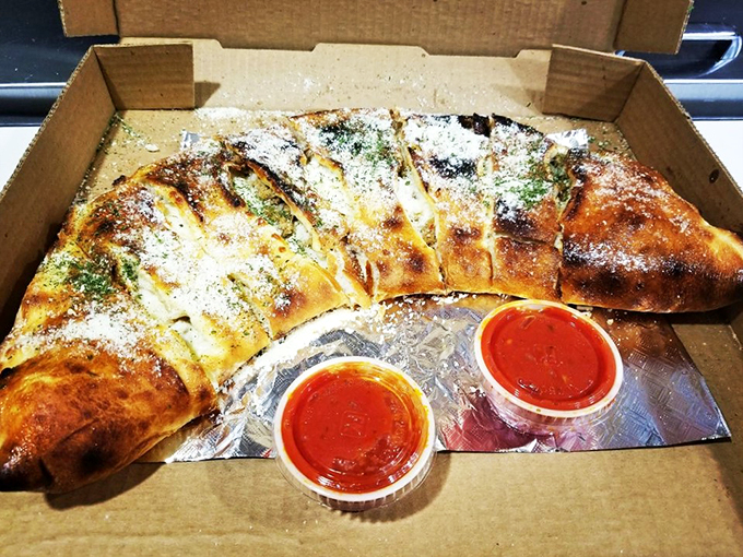 Is it a calzone or edible origami? Either way, this cheesy masterpiece is begging to be devoured.