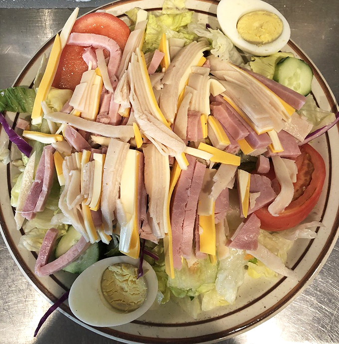 A colorful parade of fresh ingredients marches across crisp lettuce - proof that even salads can have star power at Sal's.