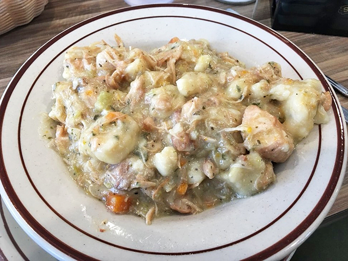 Comfort food alert! This chicken and dumplings dish is like a warm hug from your grandma, if your grandma was a culinary genius.