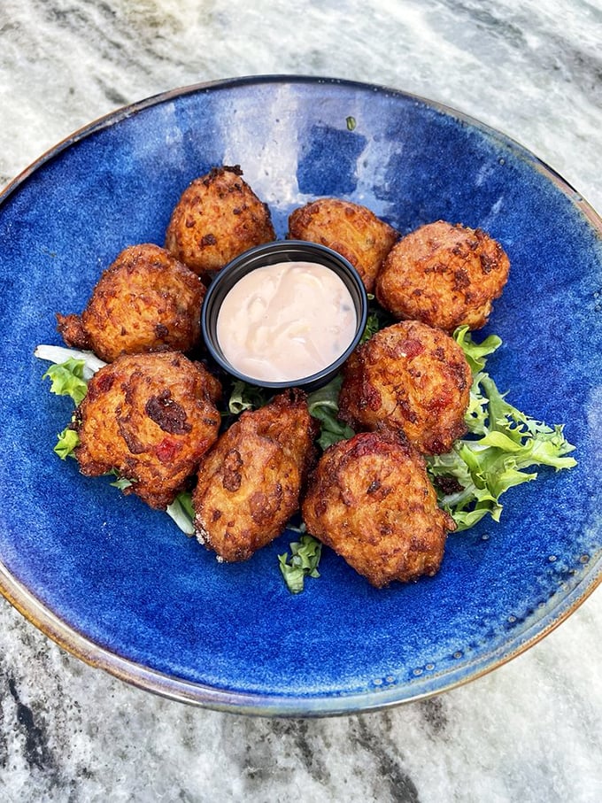 Conch fritters: little balls of happiness that pack a flavorful punch. They're like edible beach souvenirs, minus the sand in your shorts. Photo credit: Mariah G.