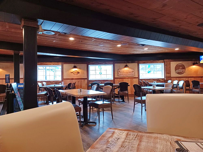 Rustic meets refined in this cozy dining space, where wood-paneled walls and comfortable seating create the perfect spot for lingering conversations.