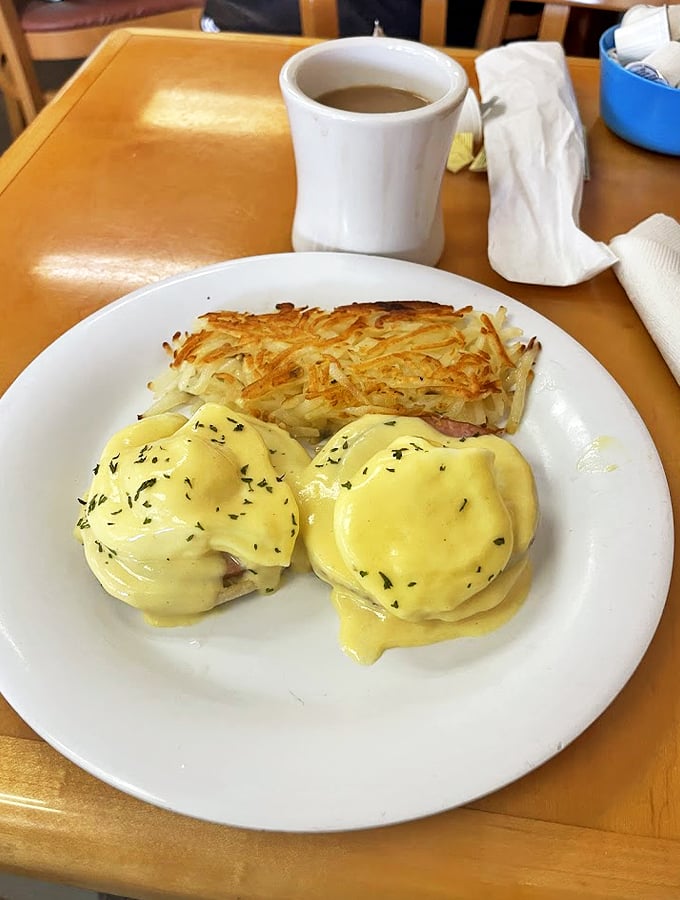 Eggs Benedict so perfect, it could make a grown man weep. Hollandaise sauce smoother than a Barry White ballad.
