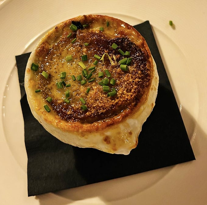 Behold, the crown jewel of soups! This French onion masterpiece is cheesier than a dad joke and twice as satisfying. Photo credit: Chris C.