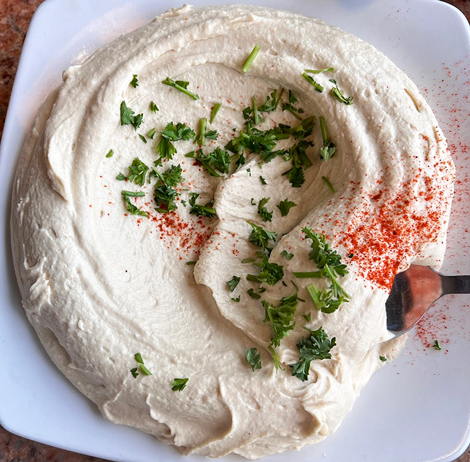 Smooth operator alert! This hummus is so creamy, it could teach a masterclass in texture. It's not just a dip; it's a work of art.