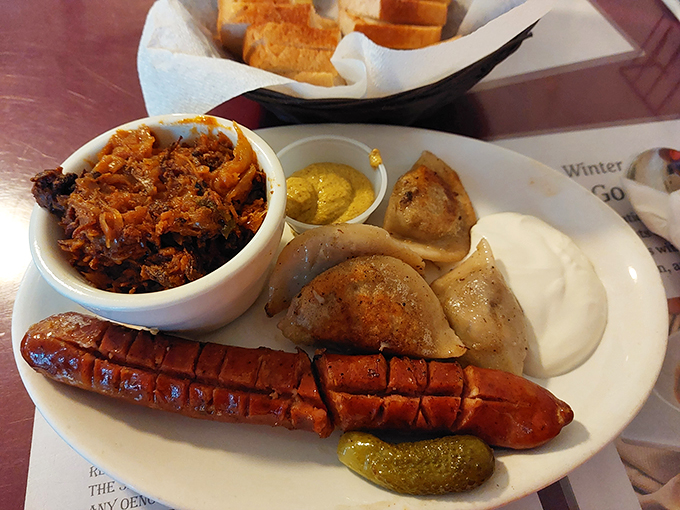 The holy trinity of comfort food: kielbasa, pierogi, and sauerkraut. It's like a Polish potluck decided to crash a fancy dinner party. Photo credit: M.F.