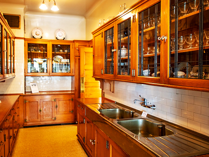 Julia Child would swoon! This gleaming kitchen is a copper-clad testament to early 20th-century culinary ambitions.