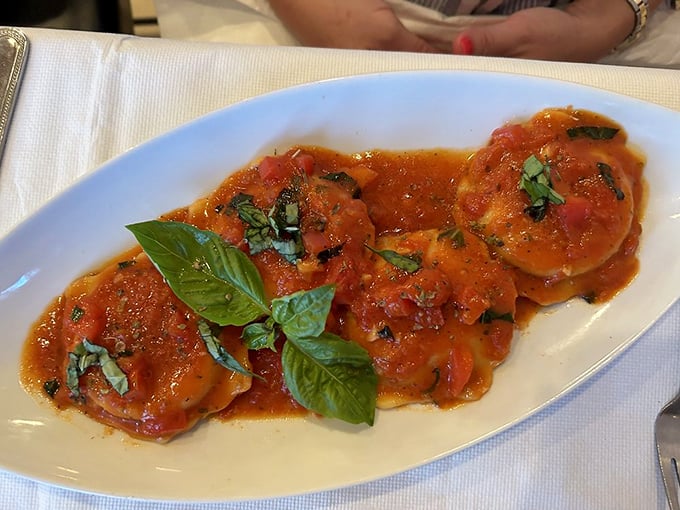 Lobster ravioli: where pasta meets luxury. Each bite is like a warm hug from the Mediterranean, with a gentle reminder that you're actually in Florida. 