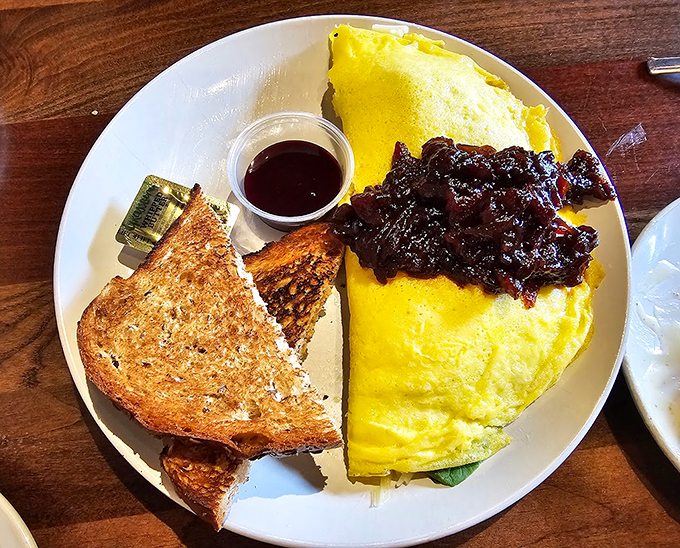 An omelet so fluffy, it might float away if it weren't anchored down by pure deliciousness.
