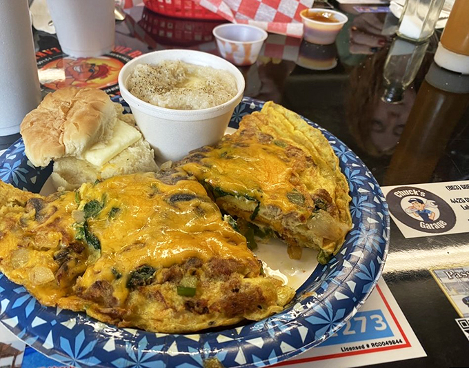 Behold, the Mona Lisa of omelets! Fluffy eggs embrace a medley of veggies and cheese, creating a breakfast masterpiece.
