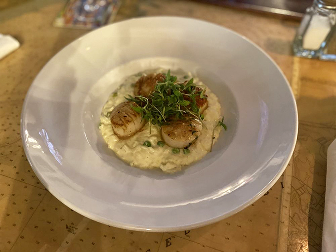 Sea scallops so perfectly seared, they could make Gordon Ramsay weep with joy. Nestled on a bed of creamy risotto, it's comfort food with a gourmet twist.
